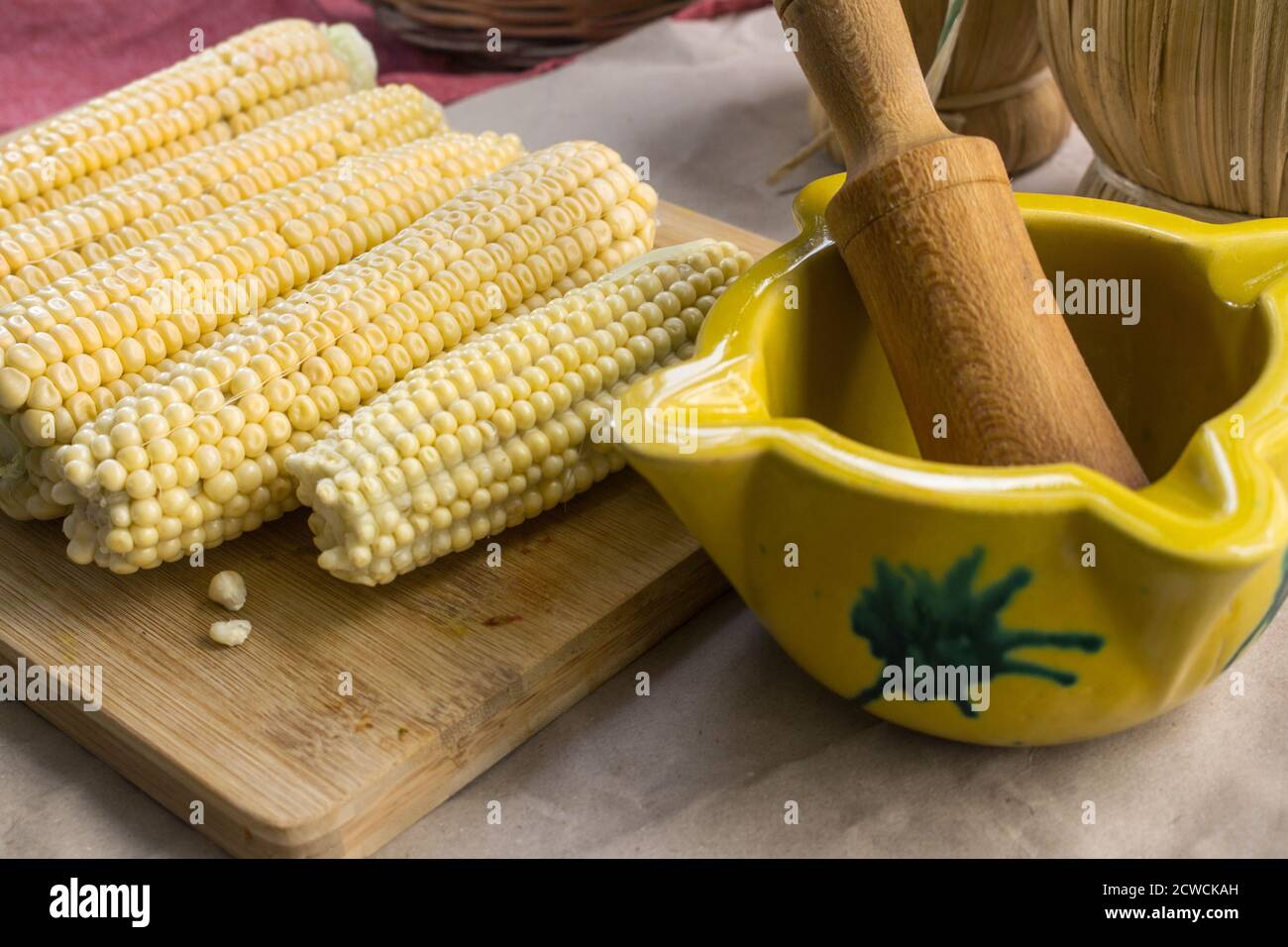 A typical Valencian ceramic mortar next to a cutting board with raw ...