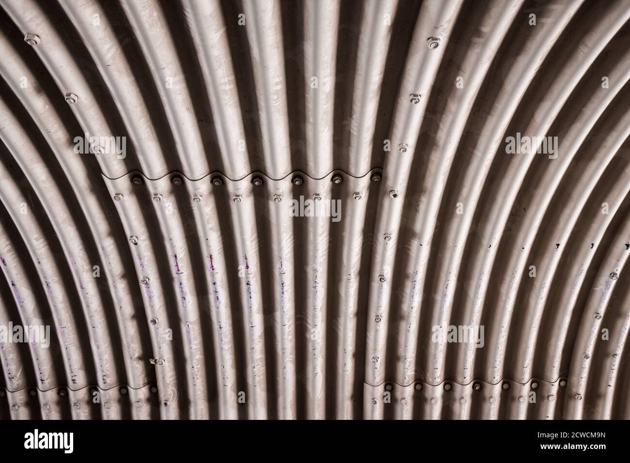 Interior of a tunnel formed with a large metal tube, construction ...