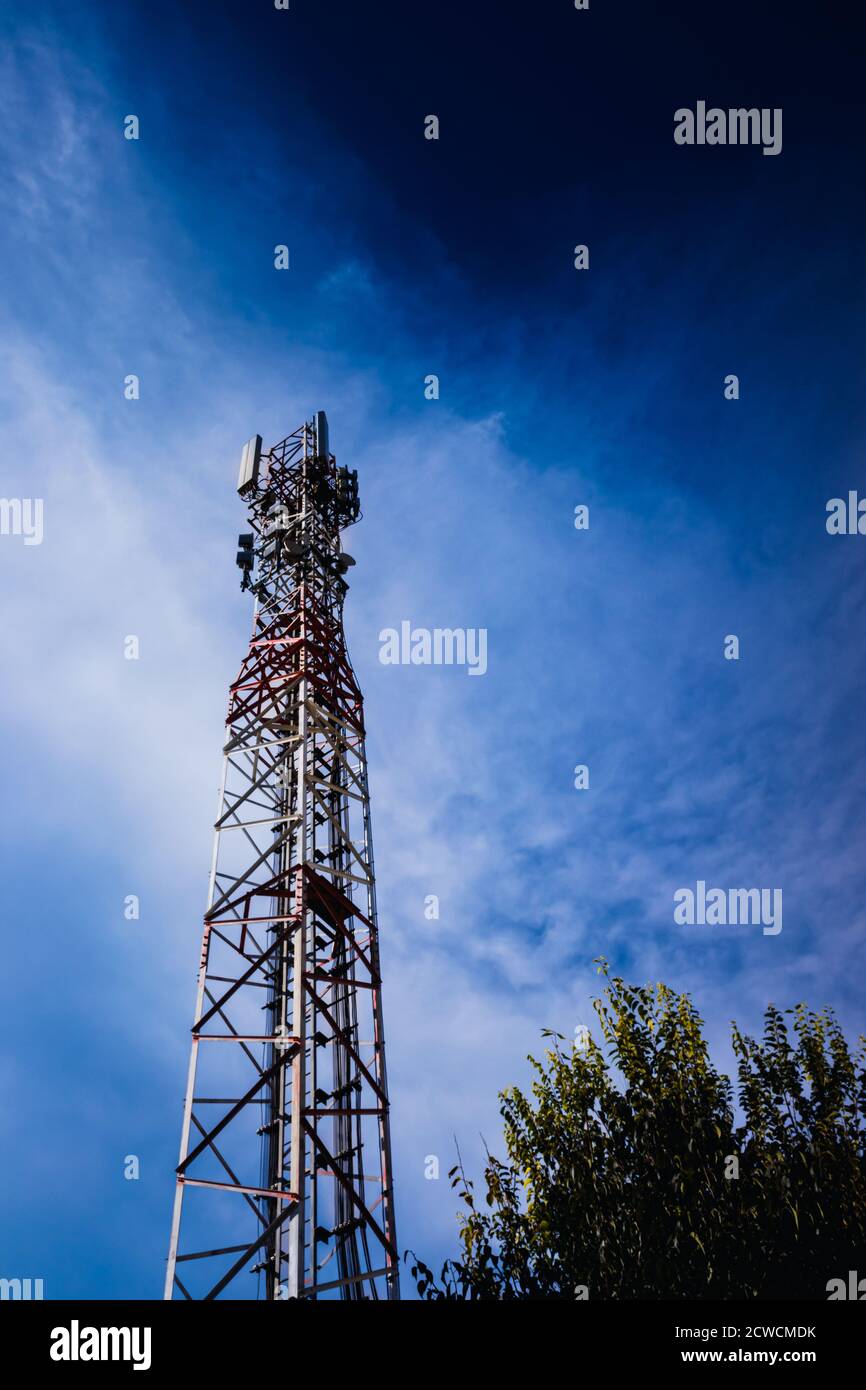 A tall modern communications tower provides telecommunications service ...