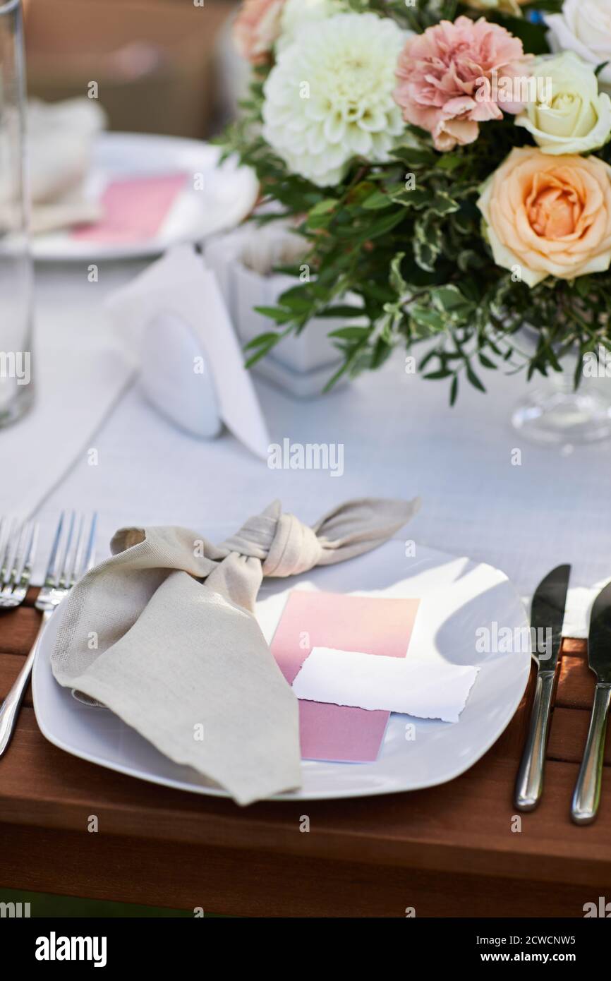 place cards for with the guest's name on the plate. dinner tables with ...