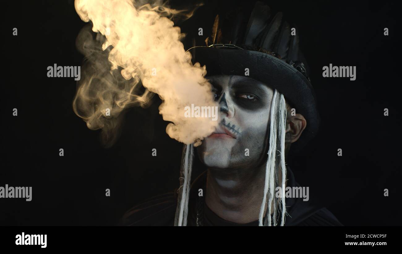 Frightening man in skeleton Halloween cosplay costume. Guy in creepy ...