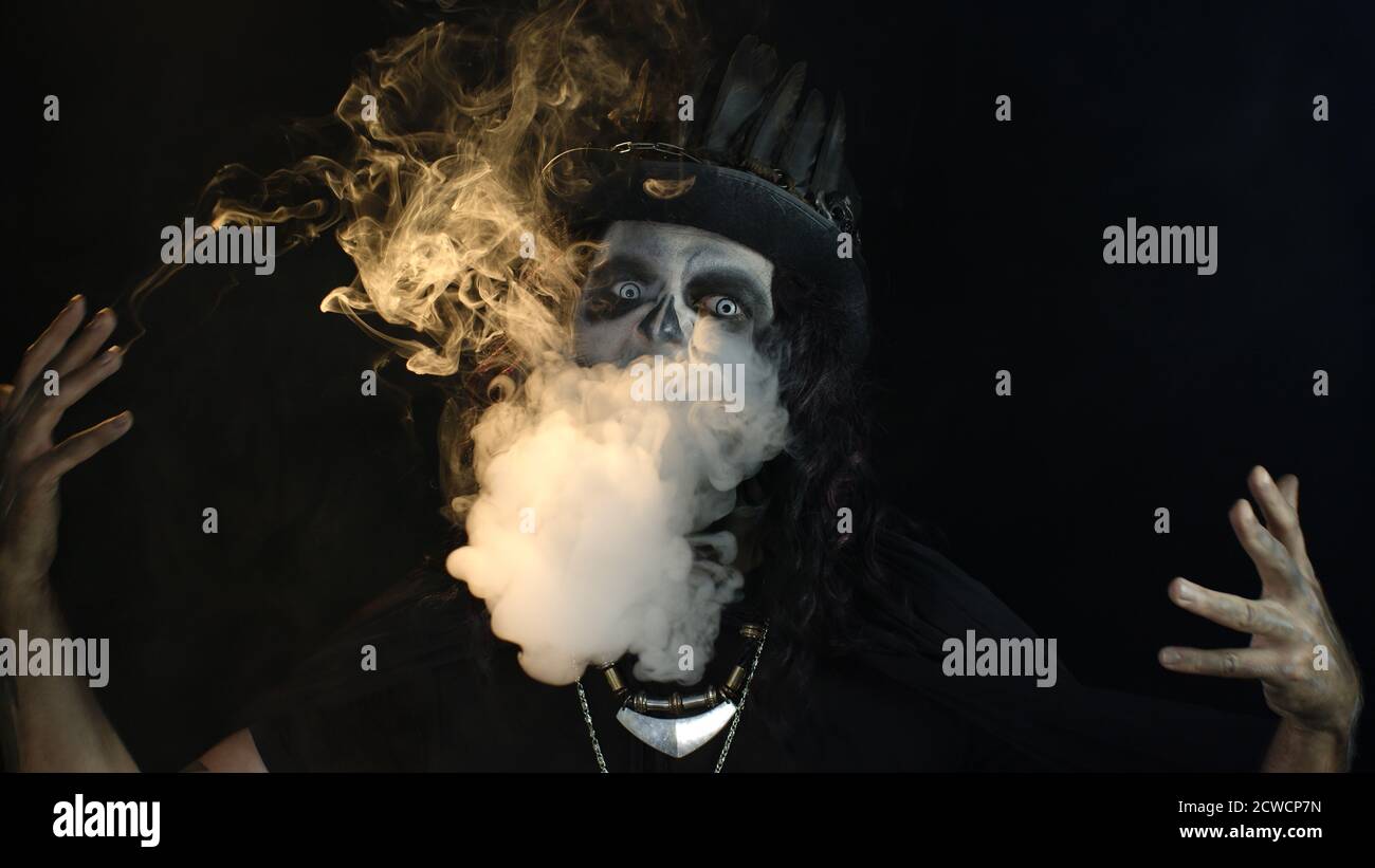 Frightening man in skeleton Halloween cosplay costume. Guy in creepy ...