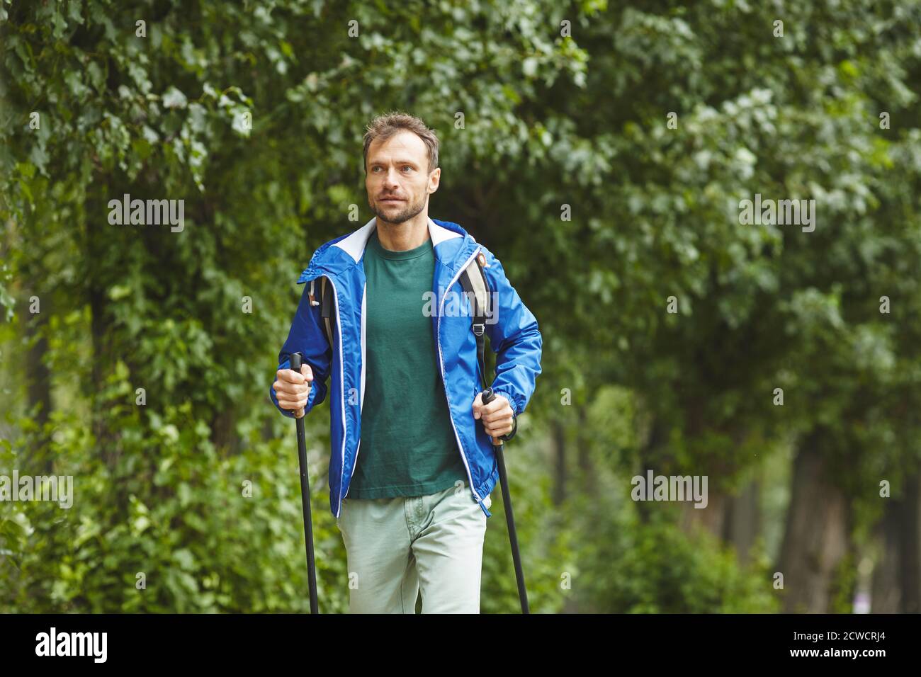 Smiling athlete man walking in hi-res stock photography and images - Alamy