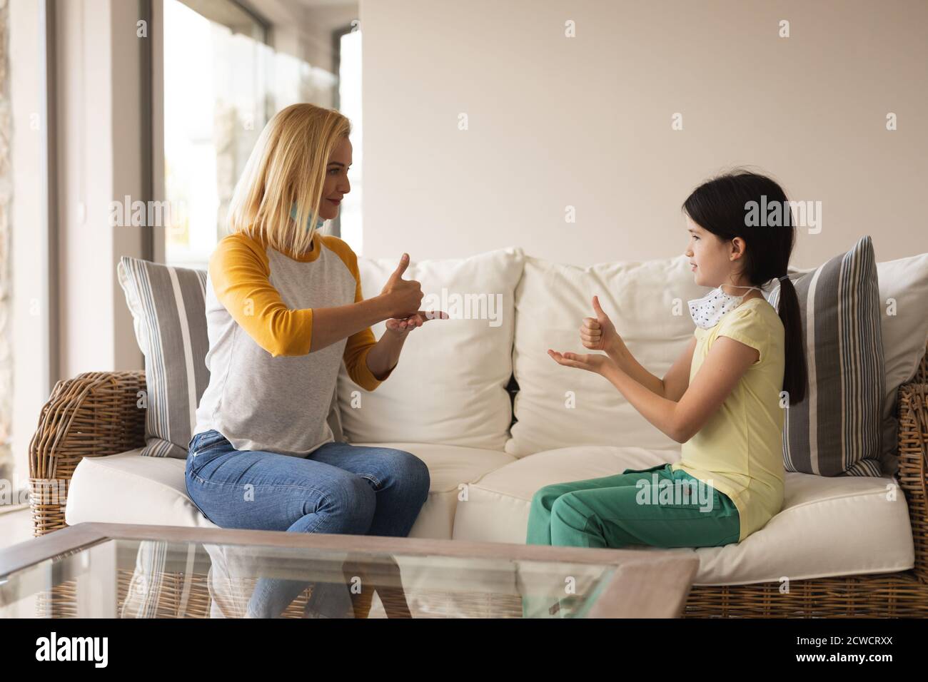 Deaf child adult using sign language hi-res stock photography and ...