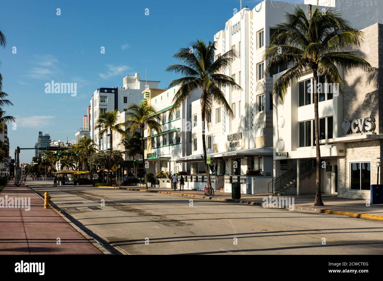 Pedestrians and shadows on Ocean Drive without any cars, in Miami Beach ...