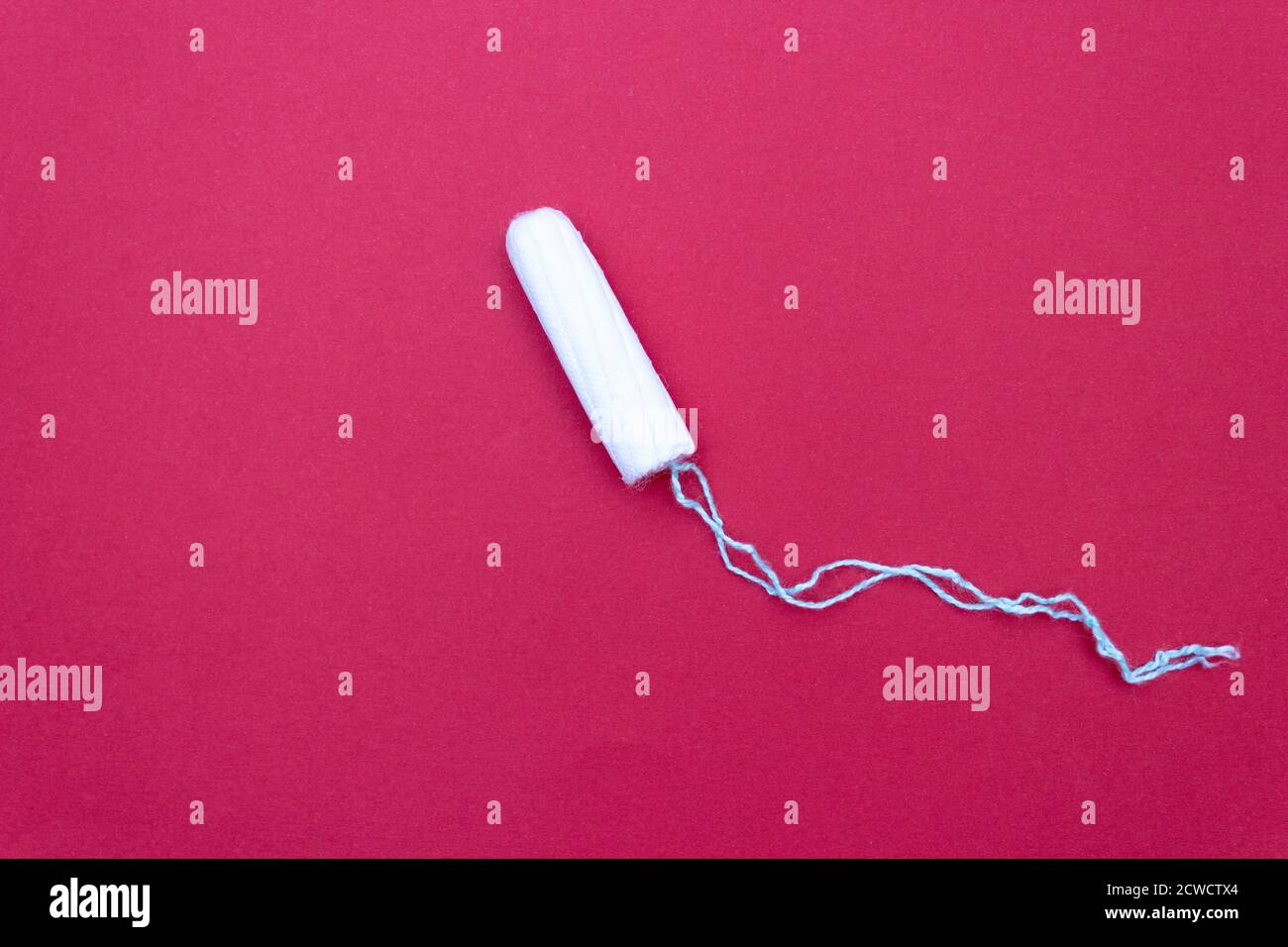 Tampon for menstruation. The concept of critical days. It's red Stock ...