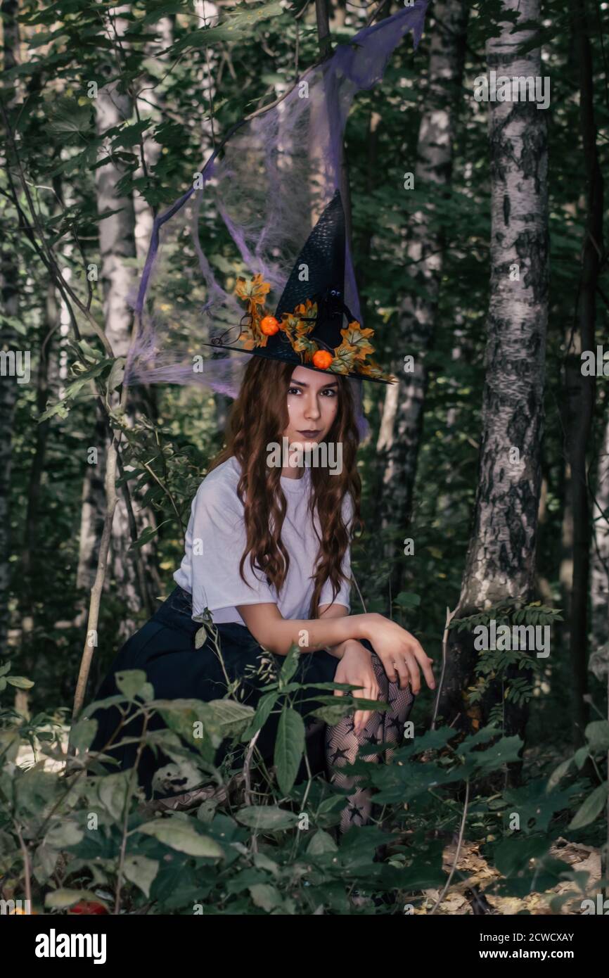 Young witch night forest hi-res stock photography and images - Alamy