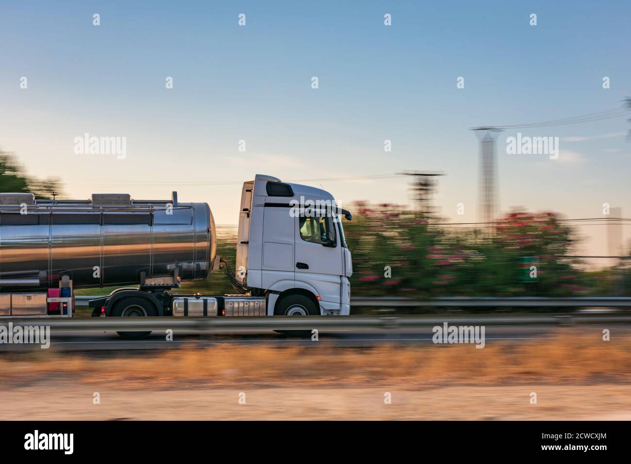Tank truck driving fast on the highway Stock Photo - Alamy