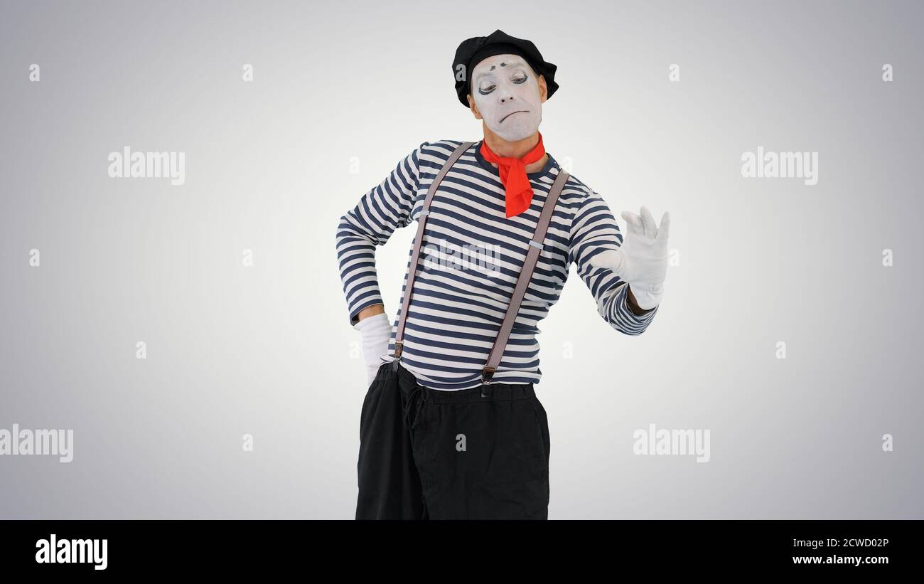 Funny mime in white gloves making selfie photos on gradient back Stock ...