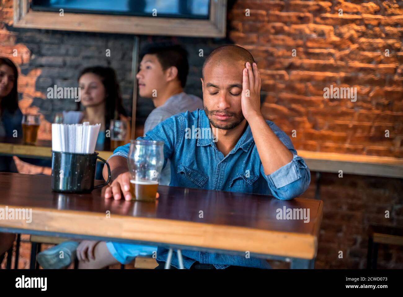 Man depressed beer bottle sitting hi-res stock photography and images ...