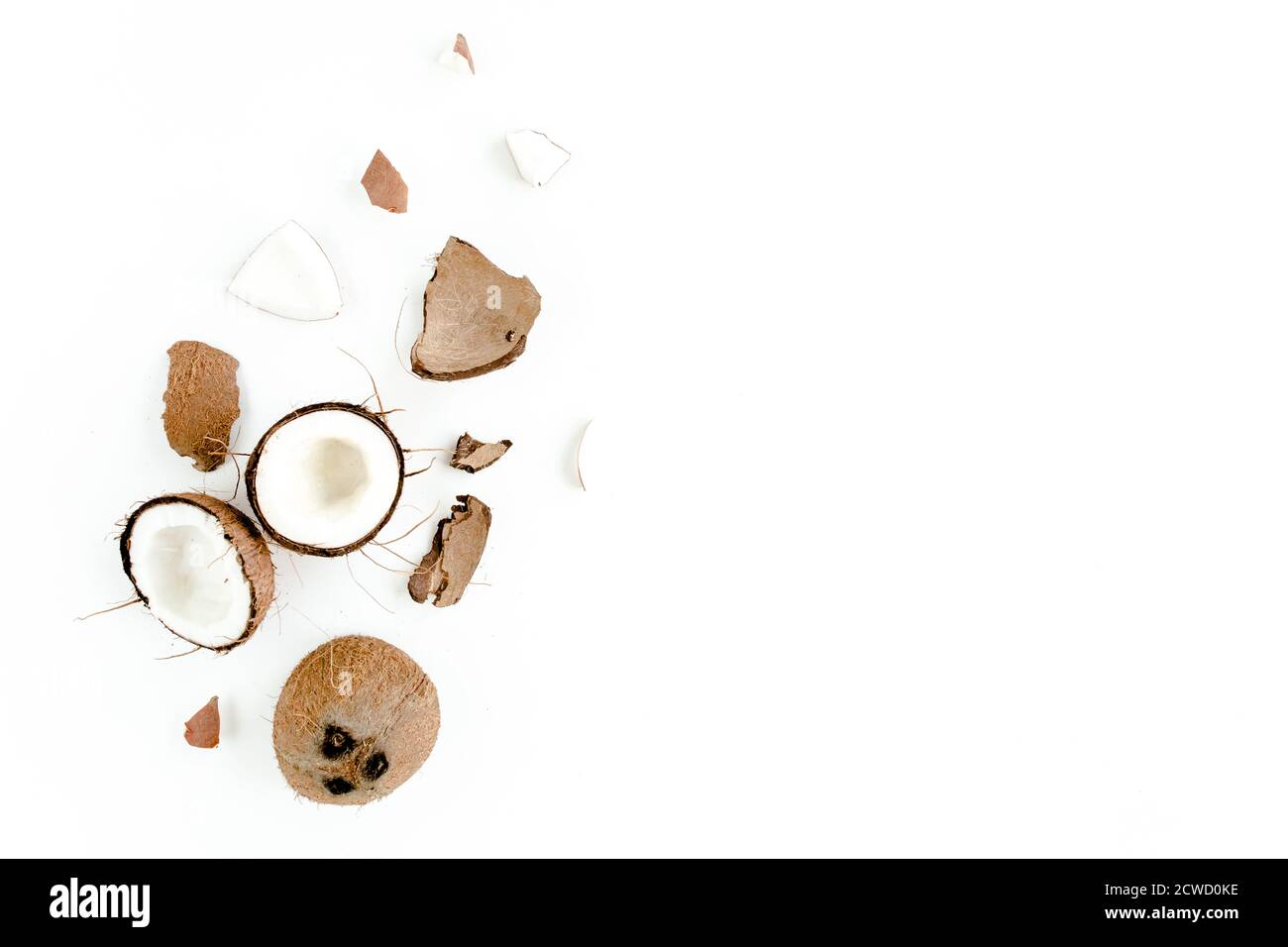 cracked coconut on white background. flat lat, top view Stock Photo - Alamy