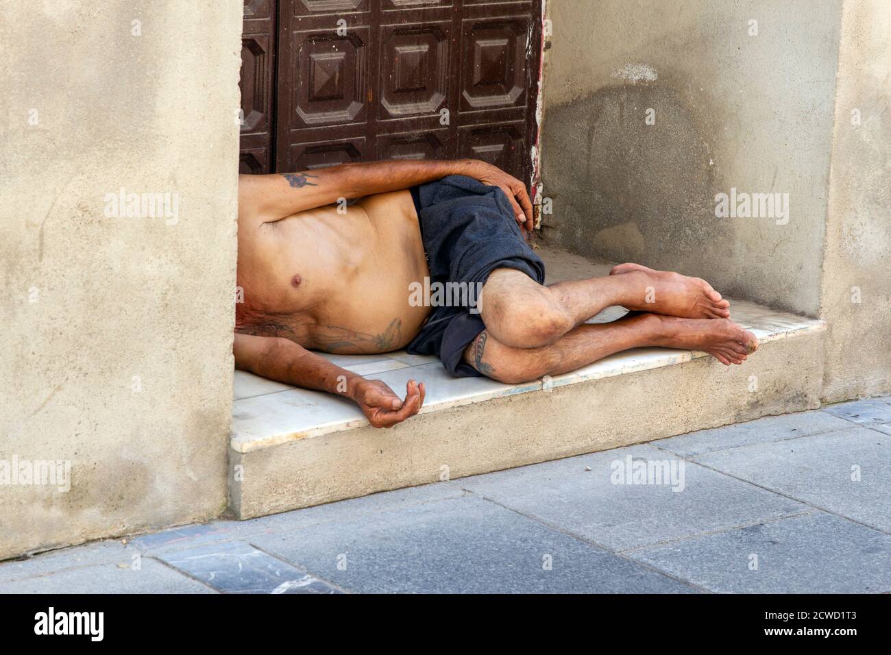 Barefoot homeless man hi-res stock photography and images - Alamy