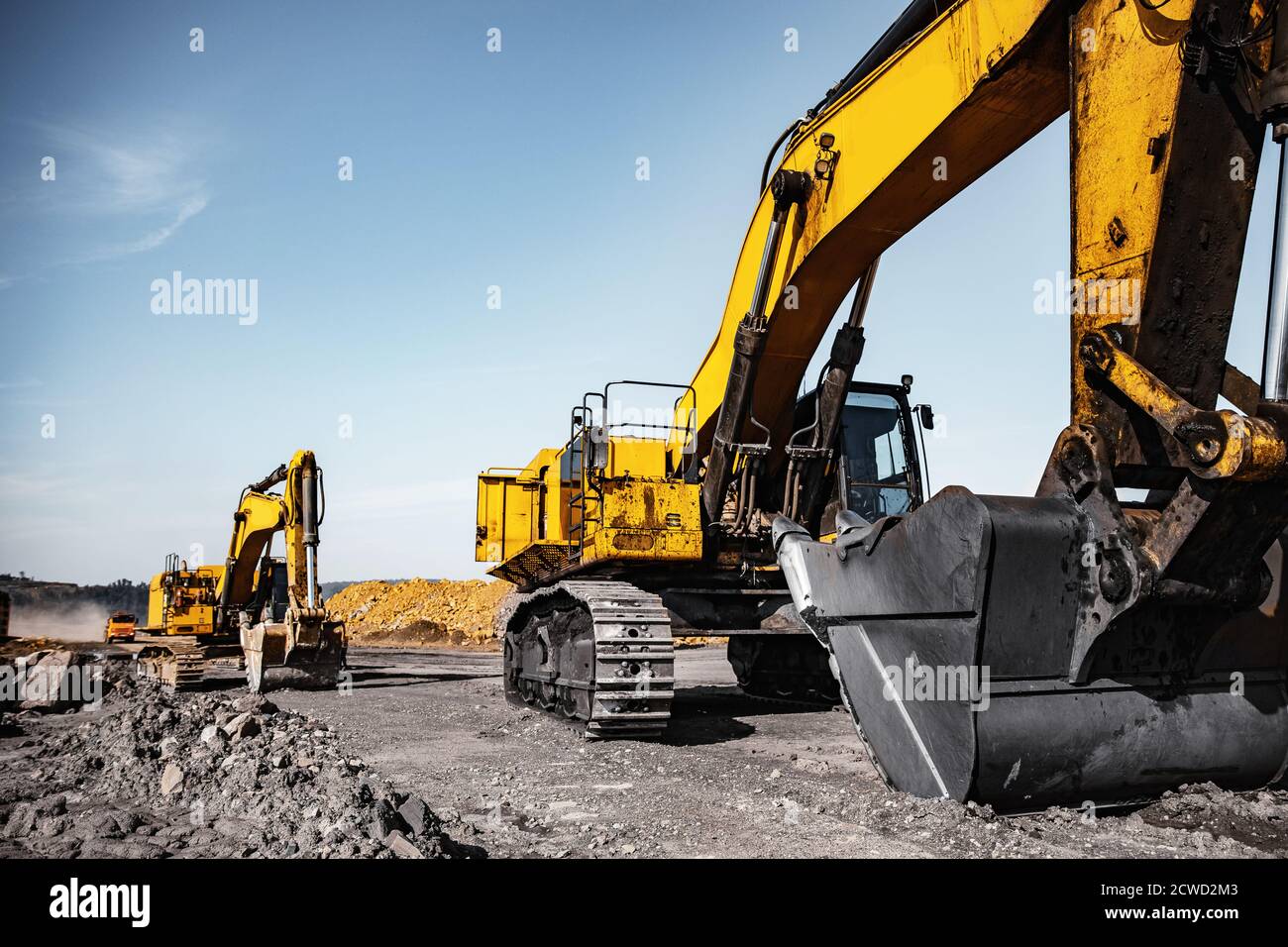 Excavator work loading of coal into Yellow mining truck. Open pit mine ...