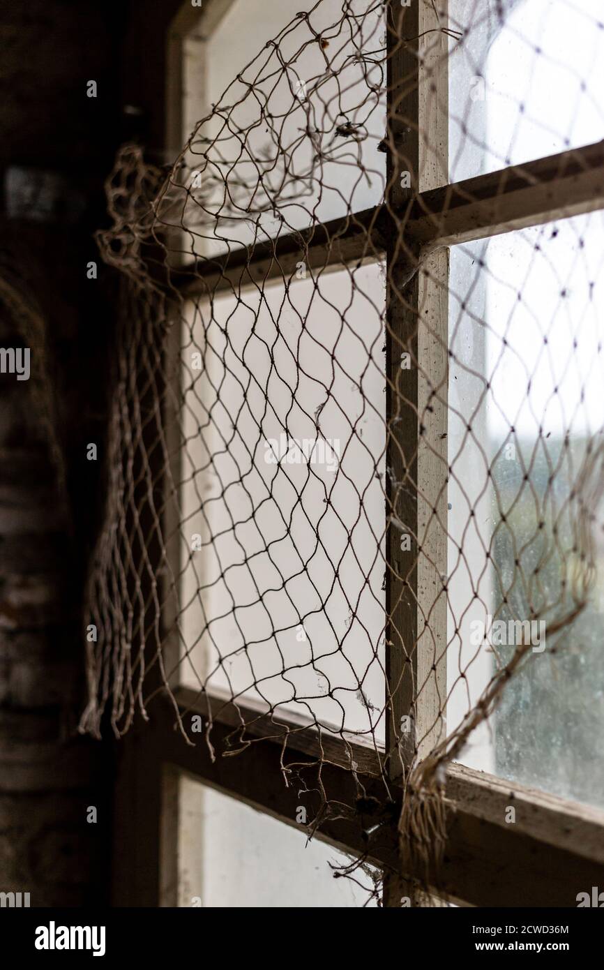 Fishing net on the window Stock Photo - Alamy