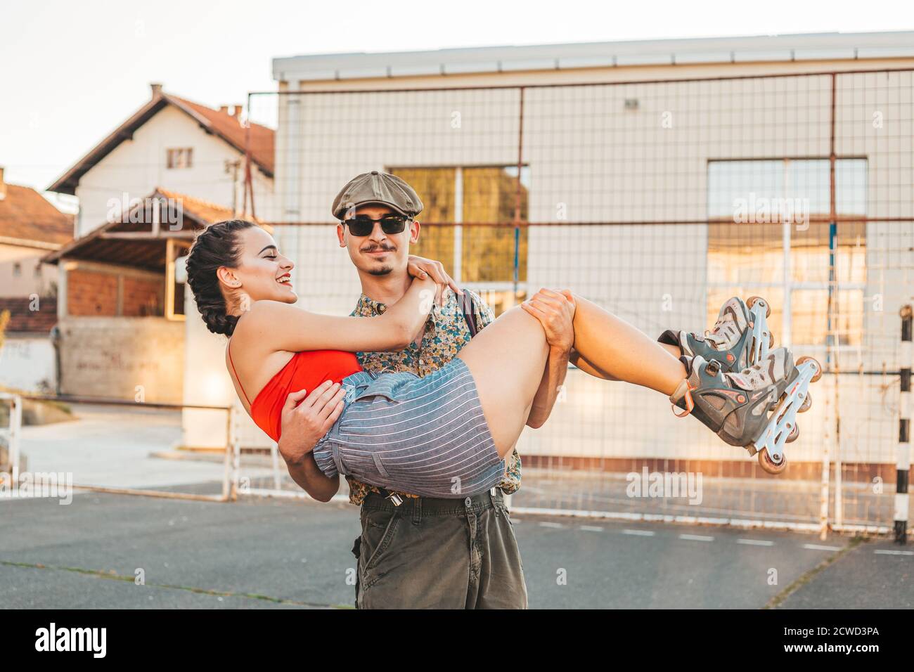 Young man holds his girlfriend in his arms Stock Photo - Alamy Young man holds his girlfriend in his arms Stock Photo - Alamy