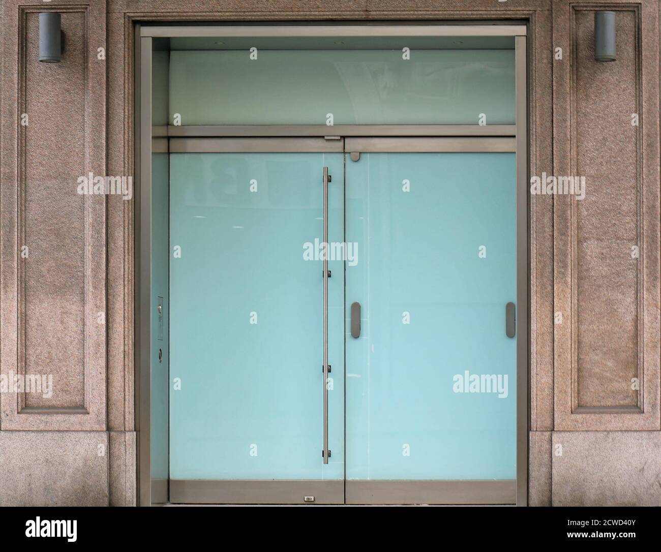 Double glass entrance door building exterior on street Stock Photo - Alamy