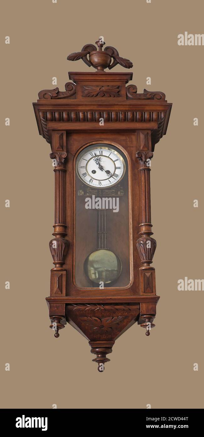 Vintage brown wooden clock on interior wall Stock Photo - Alamy