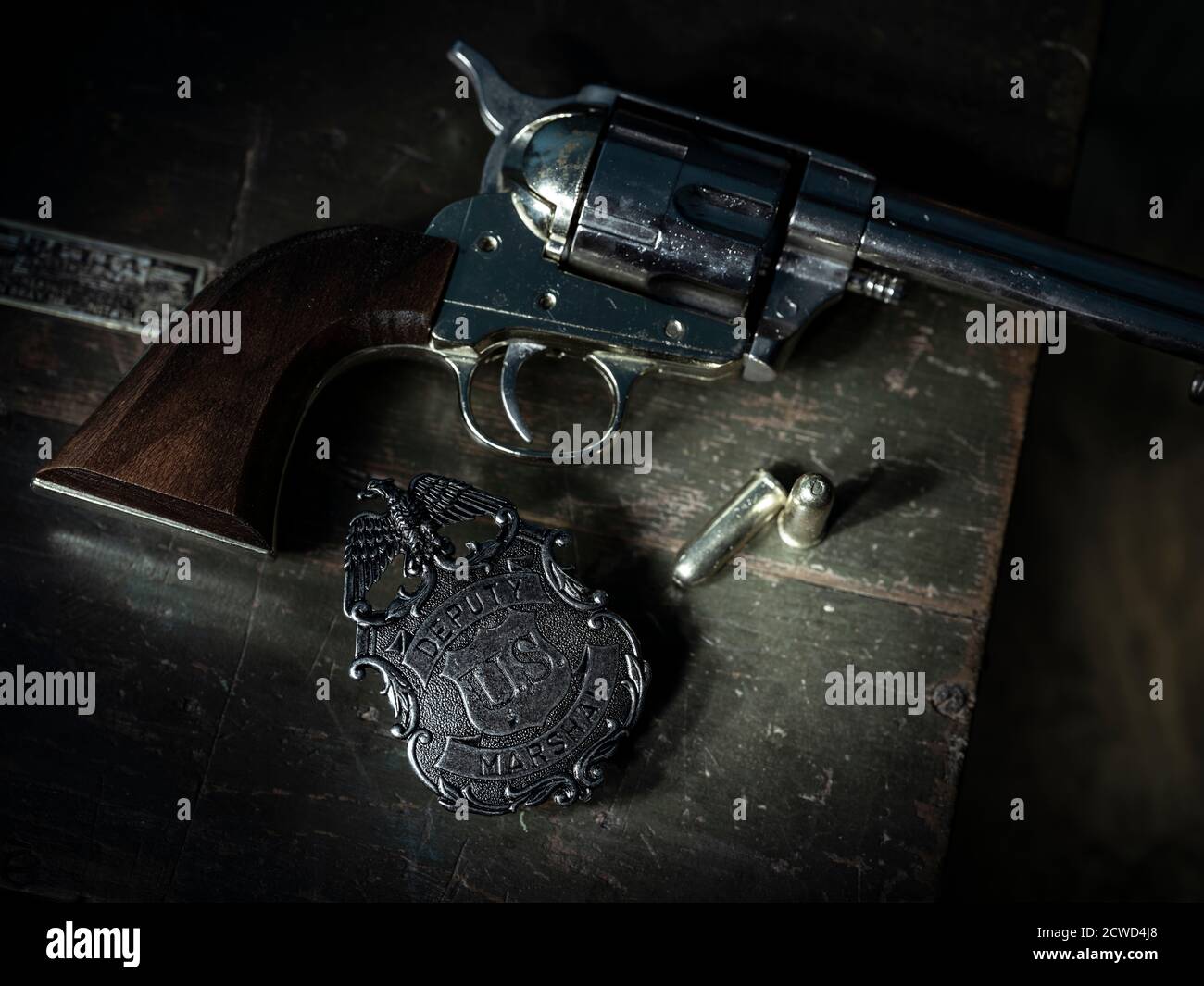 US Deputy Marshal Badge and Peacemaker Gun and Bullets Stock Photo - Alamy