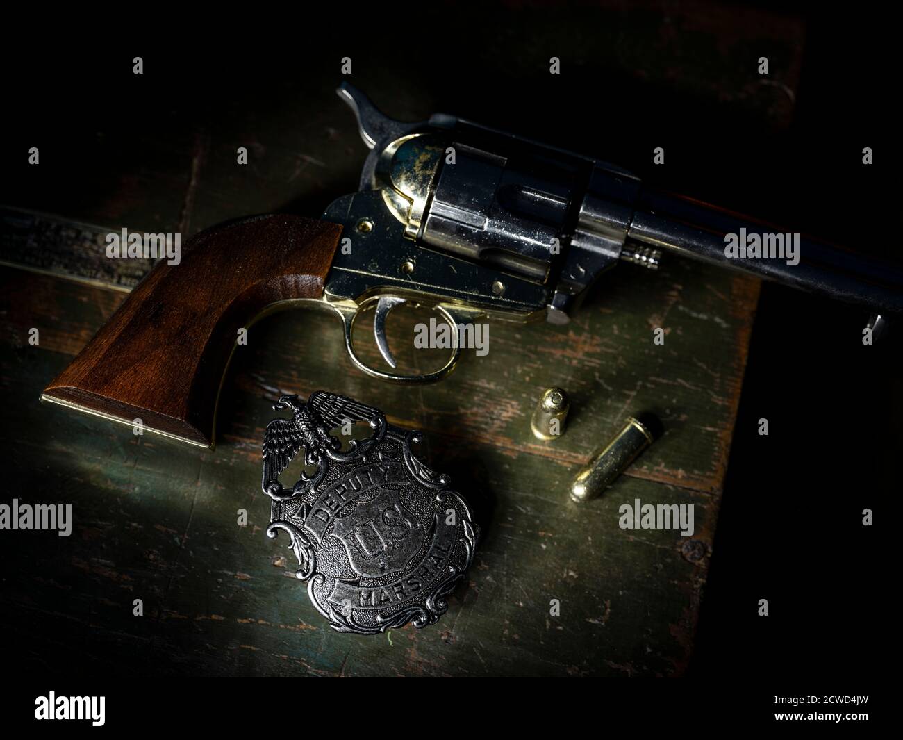 US Deputy Marshal Badge and Peacemaker Gun and Bullets Stock Photo - Alamy