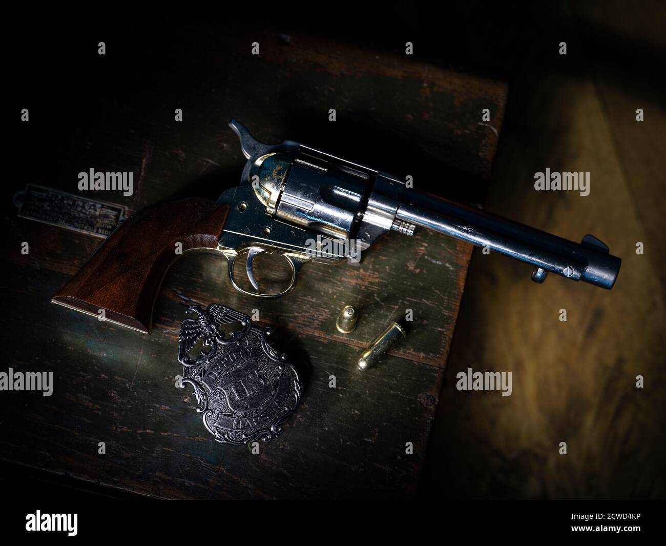 US Deputy Marshal Badge and Peacemaker Gun and Bullets Stock Photo - Alamy