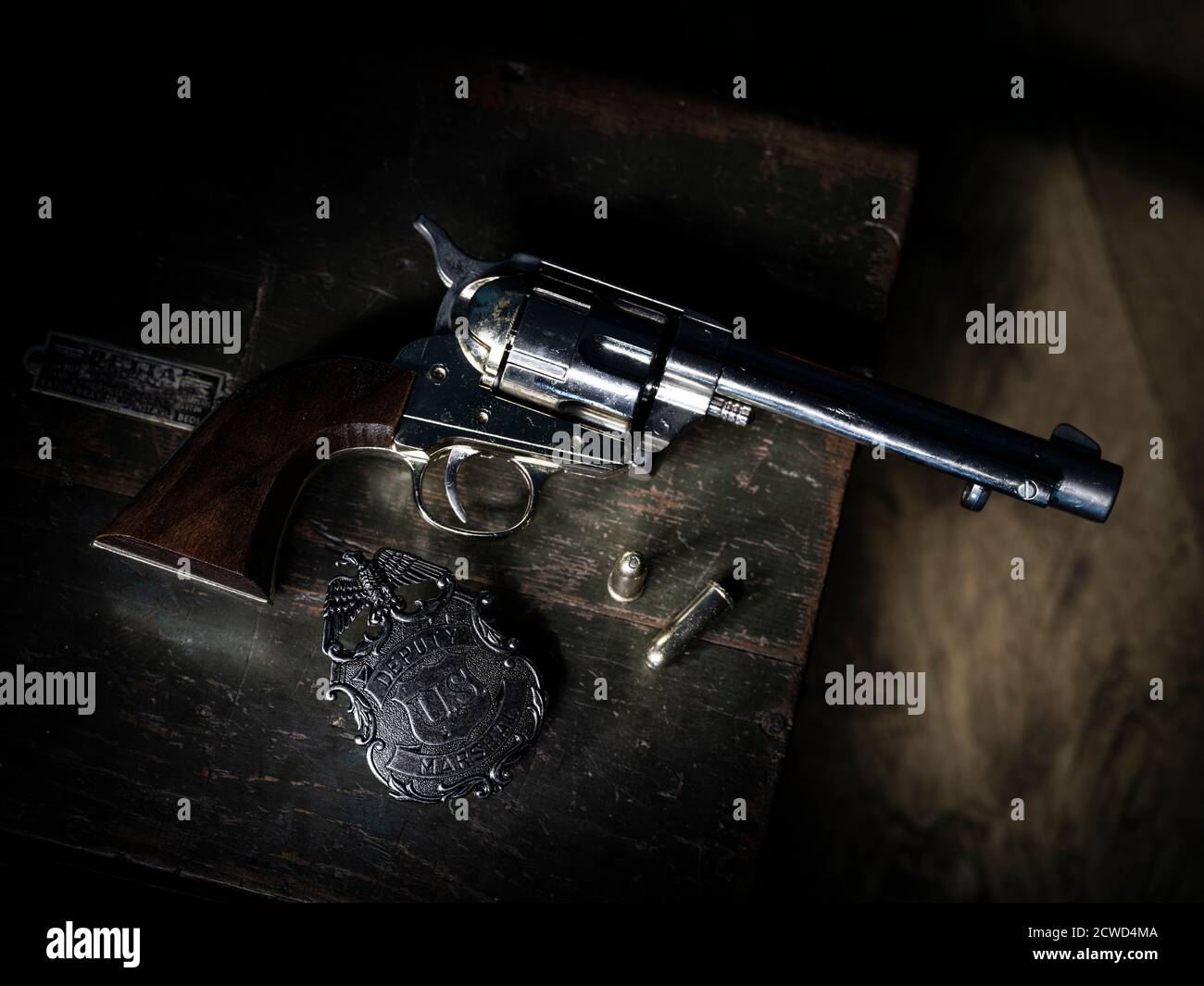US Deputy Marshal Badge and Peacemaker Gun and Bullets Stock Photo - Alamy