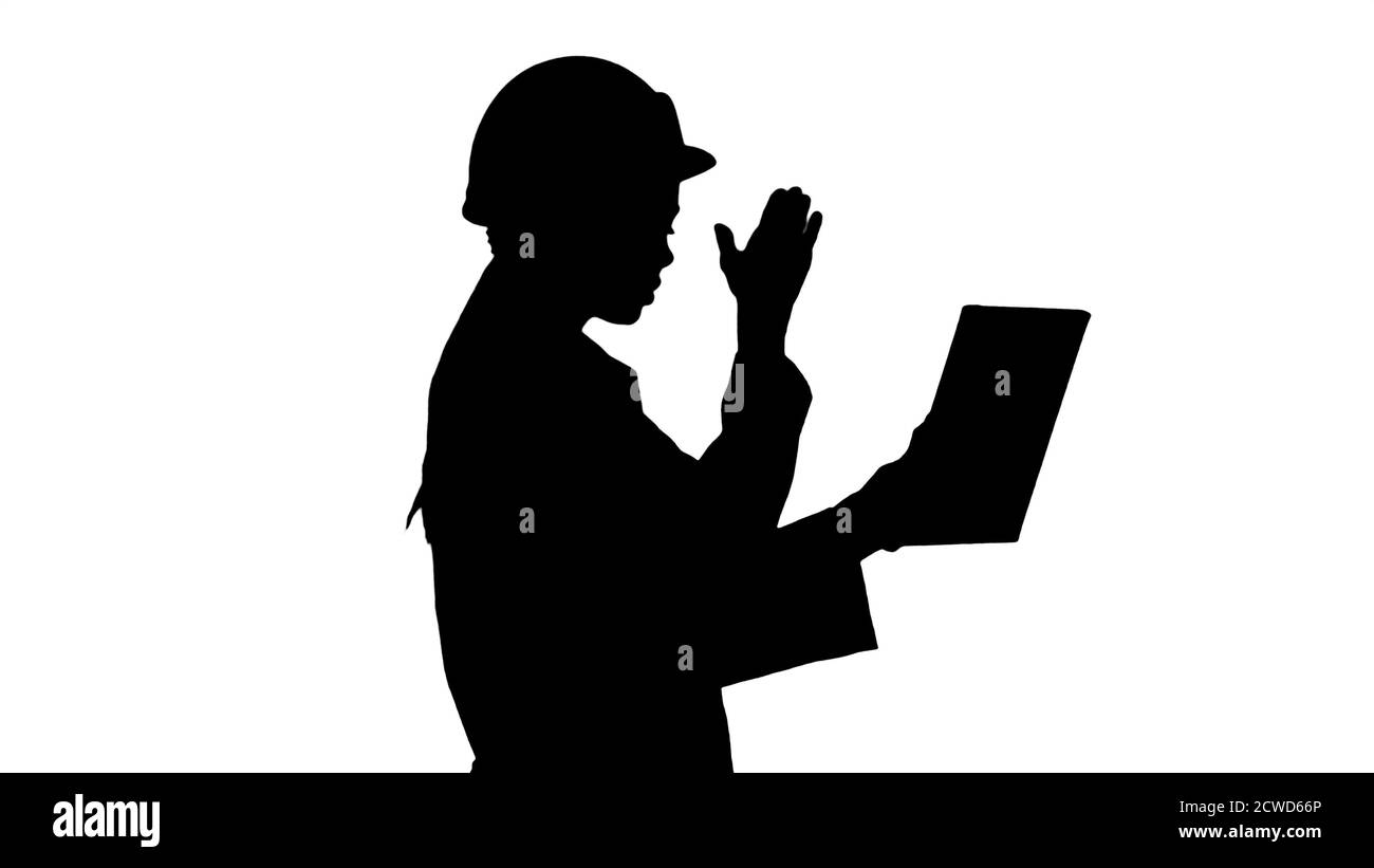 Silhouette Woman engineer with tablet making video call Stock Photo - Alamy