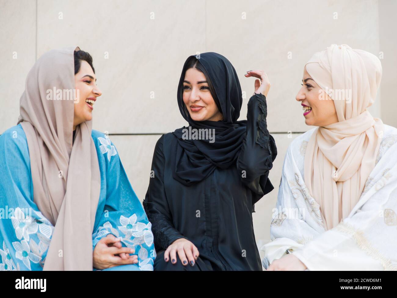 Three women friends going out in Dubai. Girls wearing the united arab ...