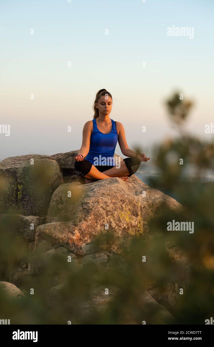 meditating girl on the mountain Stock Photo - Alamy