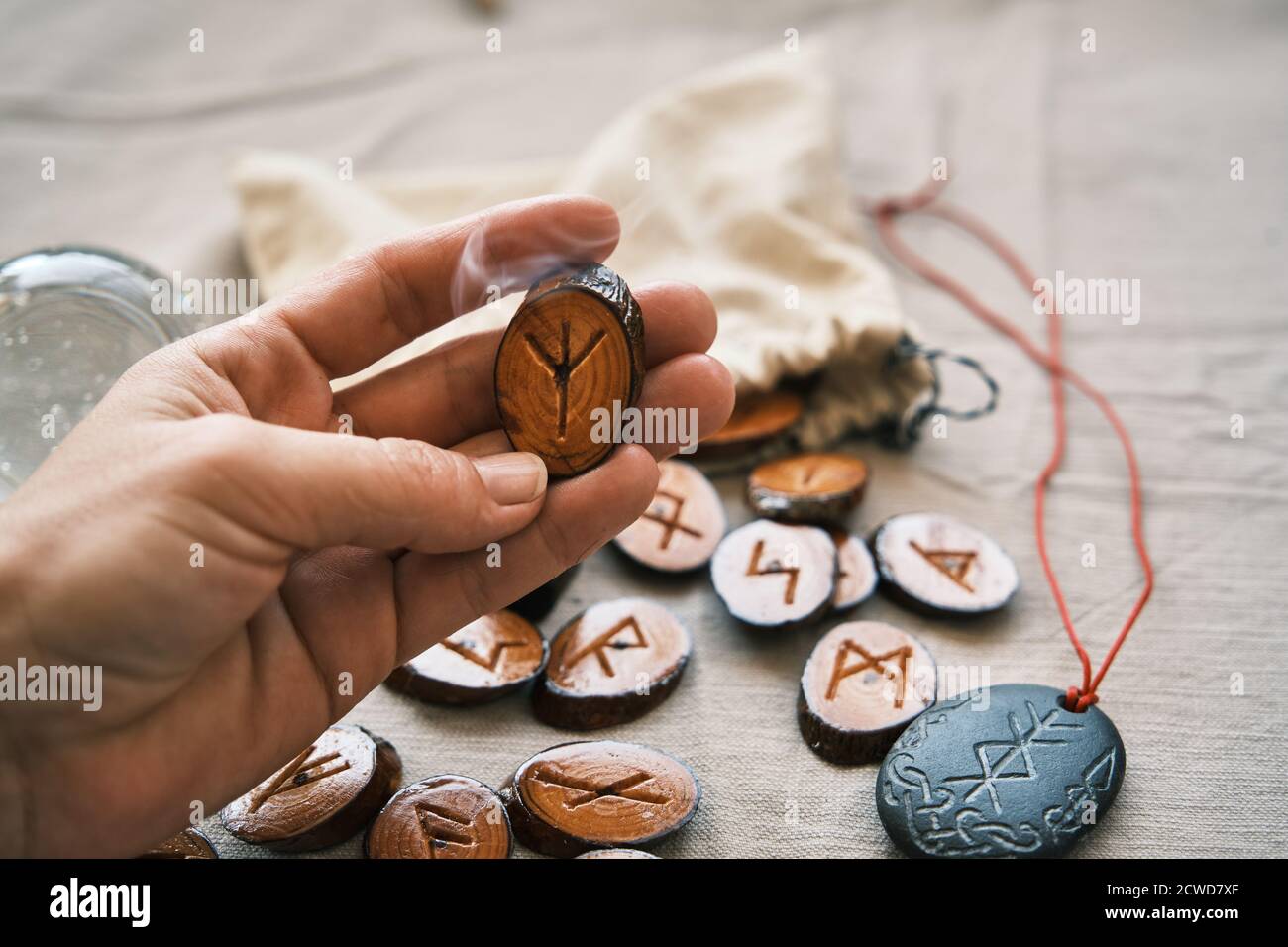 in the girl's hand are wooden runes Stock Photo - Alamy