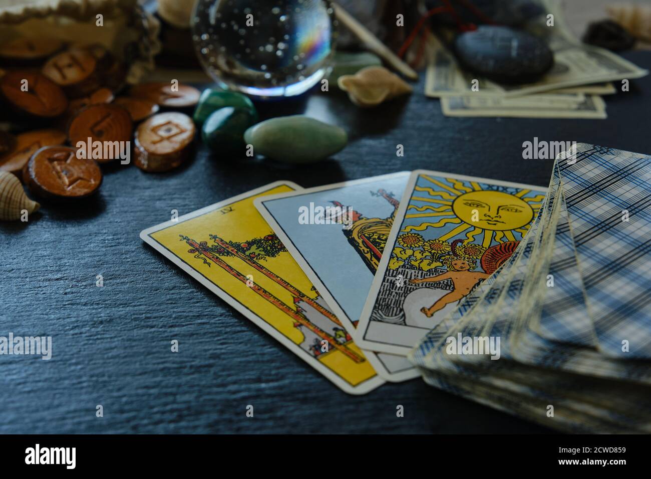 wooden runes from the Tarot card on the table Stock Photo - Alamy