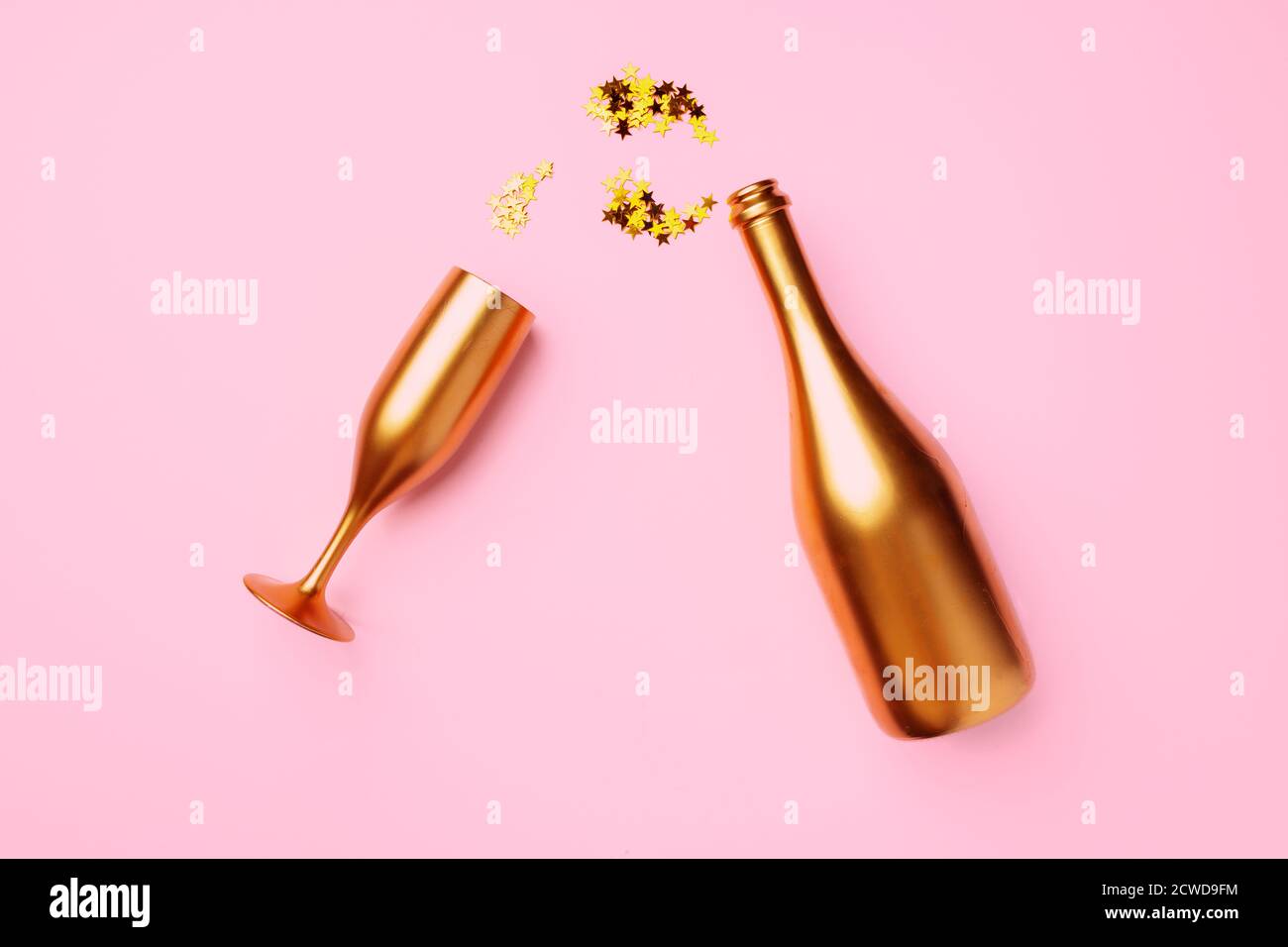 Champagne bottle with confetti flat lay top view Stock Photo - Alamy