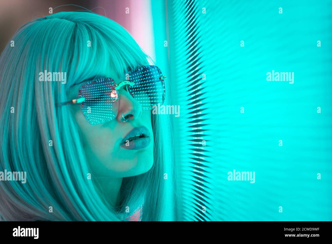 Image Of A Beautiful Young Woman Posing Against A Led Panel Teenager