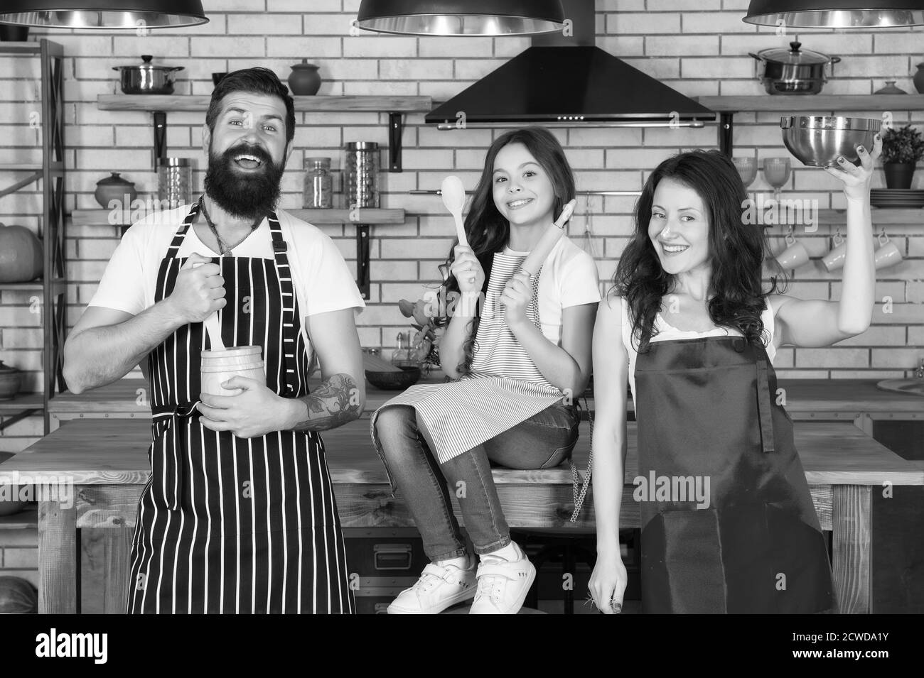 Prepare birthday cake. Friendly family. Mother father and daughter ...