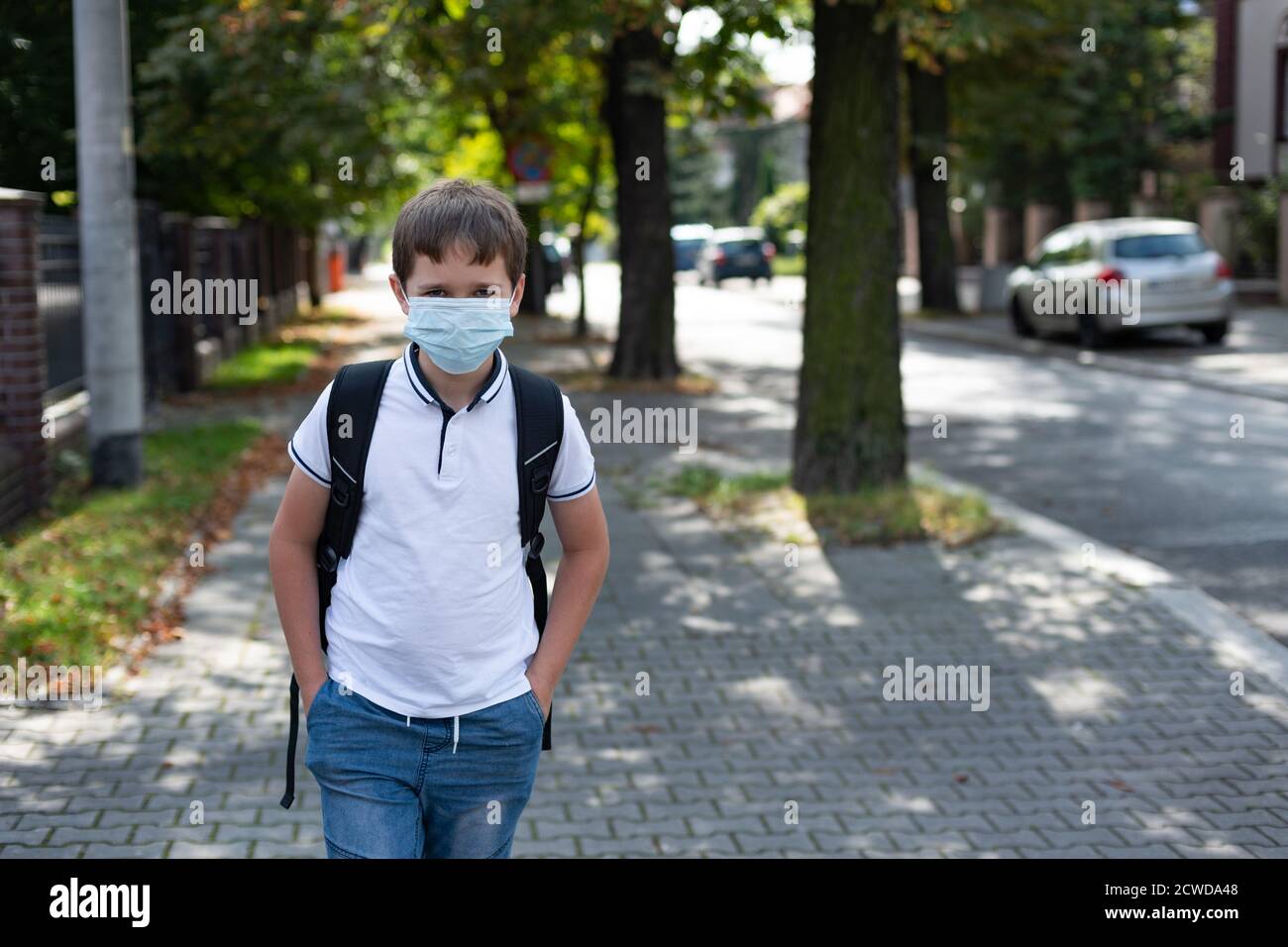 Boy in mask going to school in medical mask Stock Photo - Alamy
