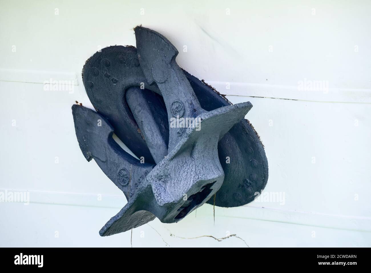 Black ship anchor at front side Stock Photo - Alamy