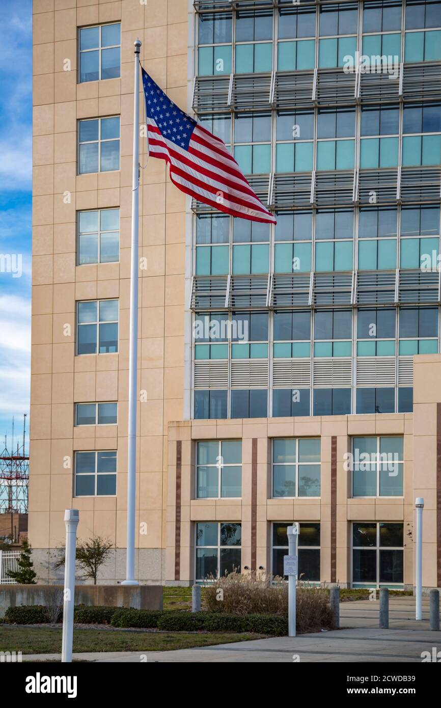 U.S. flag flying in front of the Dan M. Russell Jr. United States ...