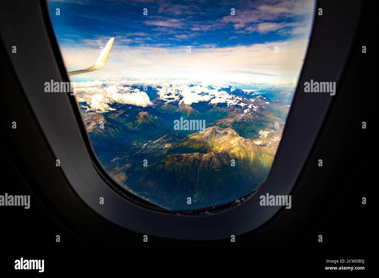 Aerial view frope plane window of Alaska ice mountains covered with ...
