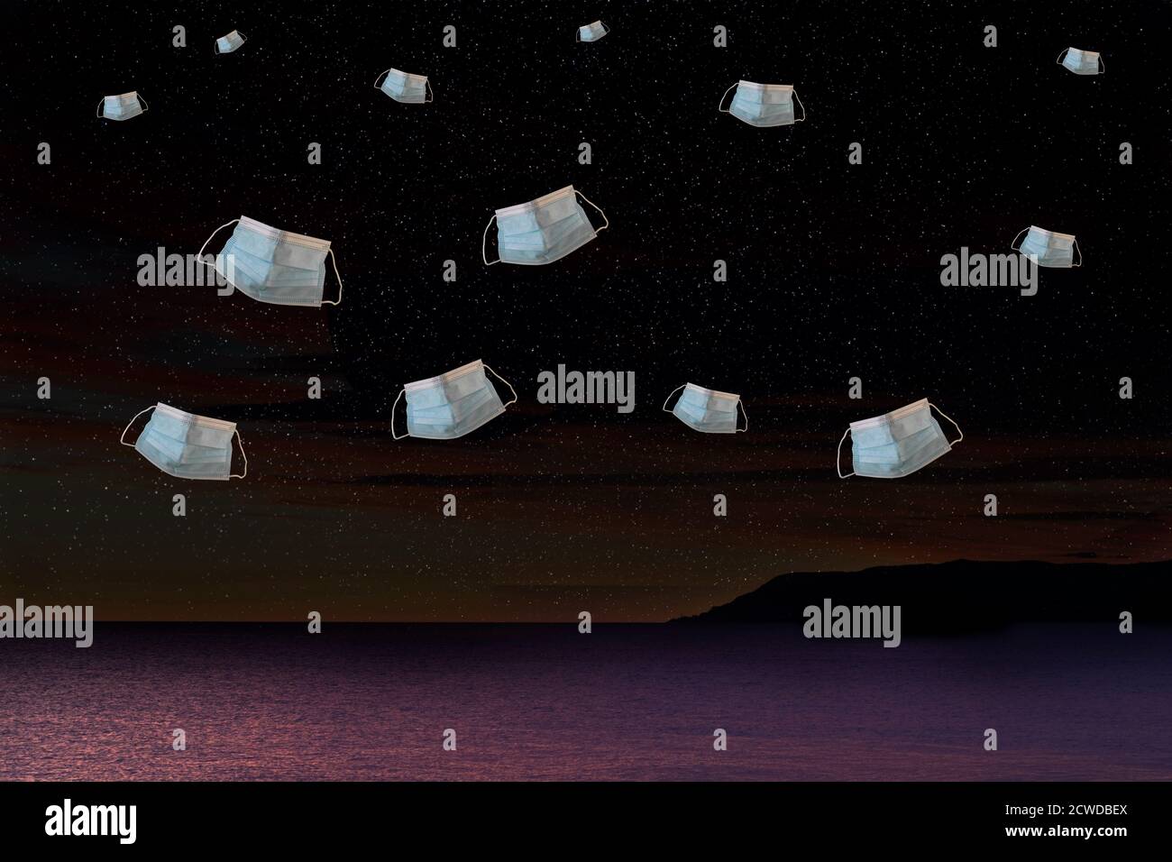 Protection face masks flying in starry night by the sea Stock Photo - Alamy