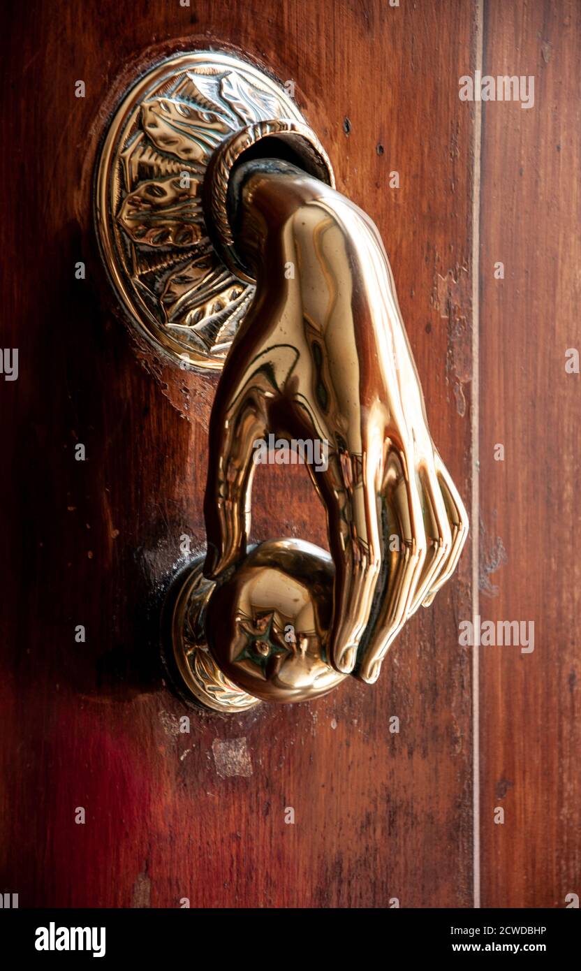 Hand shaped golden door hi-res stock photography and images - Alamy
