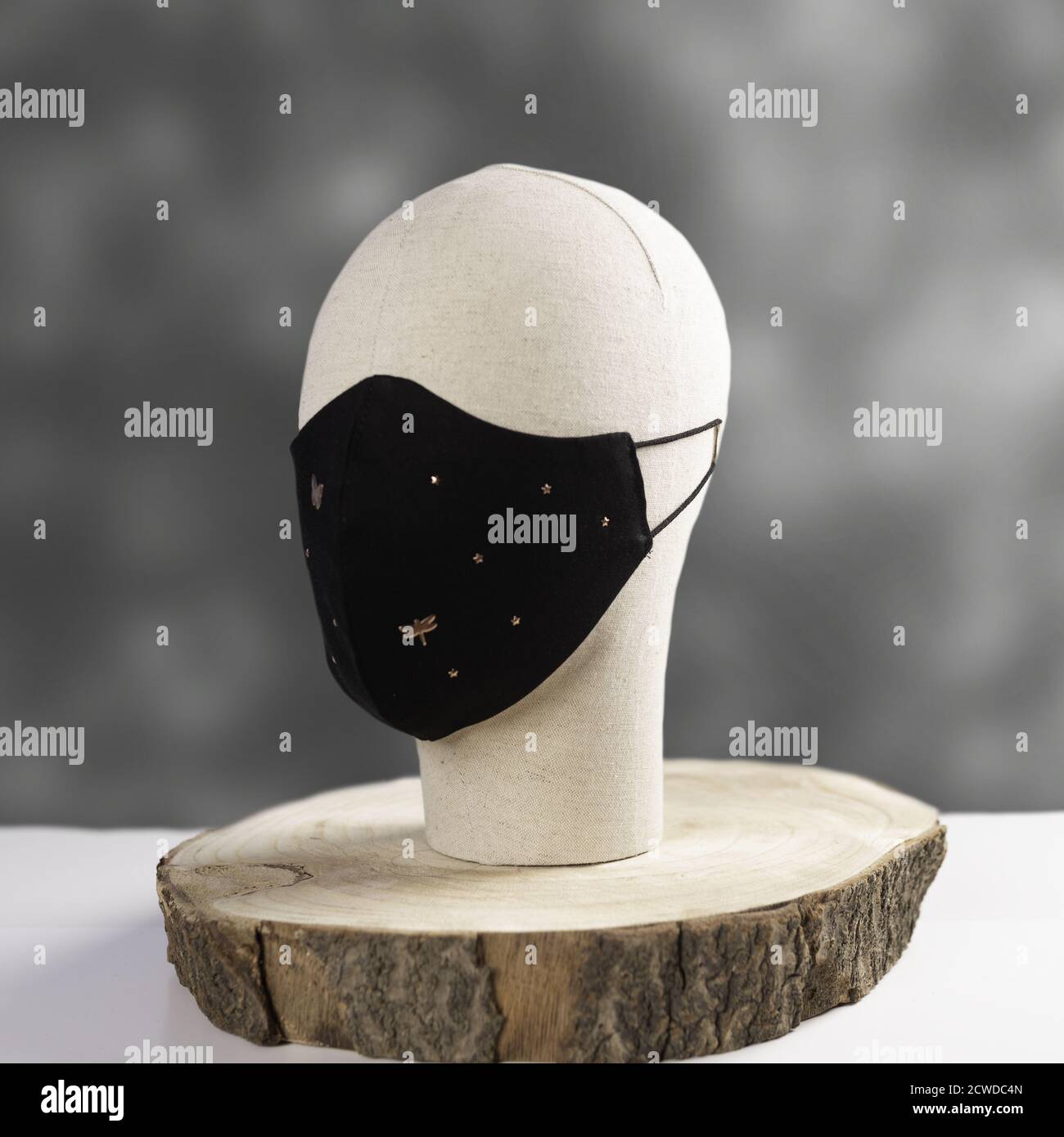 Black protective mask dotted with stars on a mannequin head Stock Photo ...