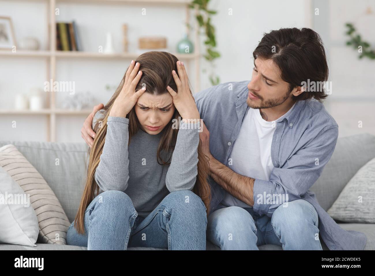 Married couple having big quarrel at home, free space Stock Photo - Alamy