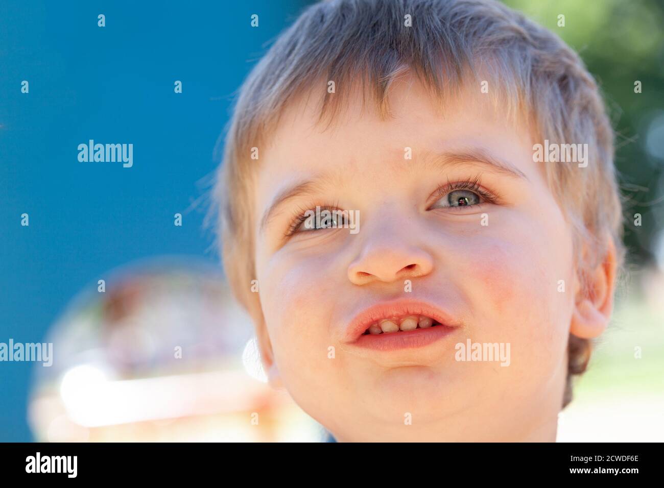Close-up portrait of a beautiful little boy. cat's eyes Stock Photo - Alamy