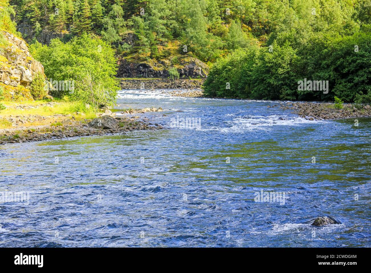 Flowing beautiful blue river lake Hemsila with mountain panorama in ...