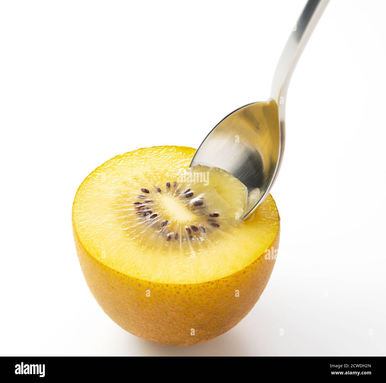 Eating Golden Kiwi with a spoon Stock Photo - Alamy