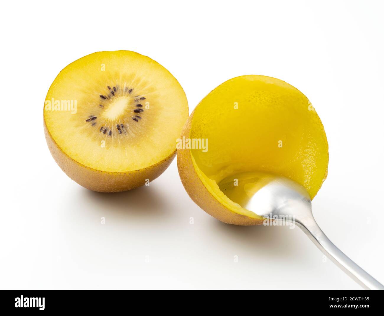 Eating Golden Kiwi with a spoon Stock Photo - Alamy