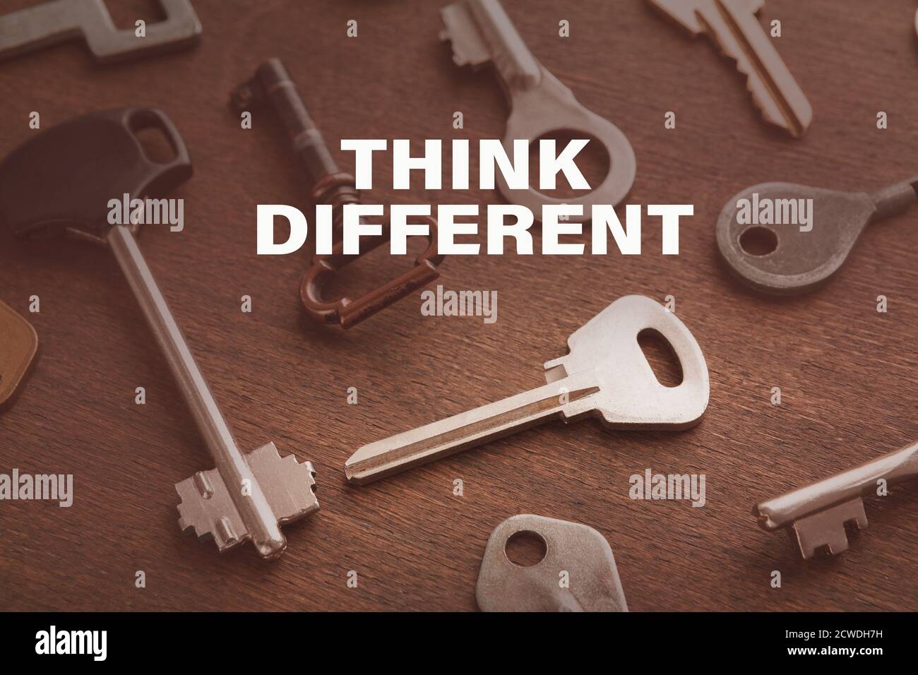 Diverse keys over wooden background and think different text Stock ...