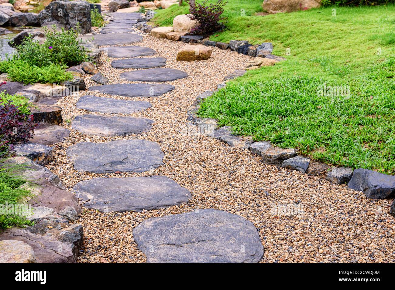 Stone stepping pathway in a Japanese style garden Stock Photo - Alamy
