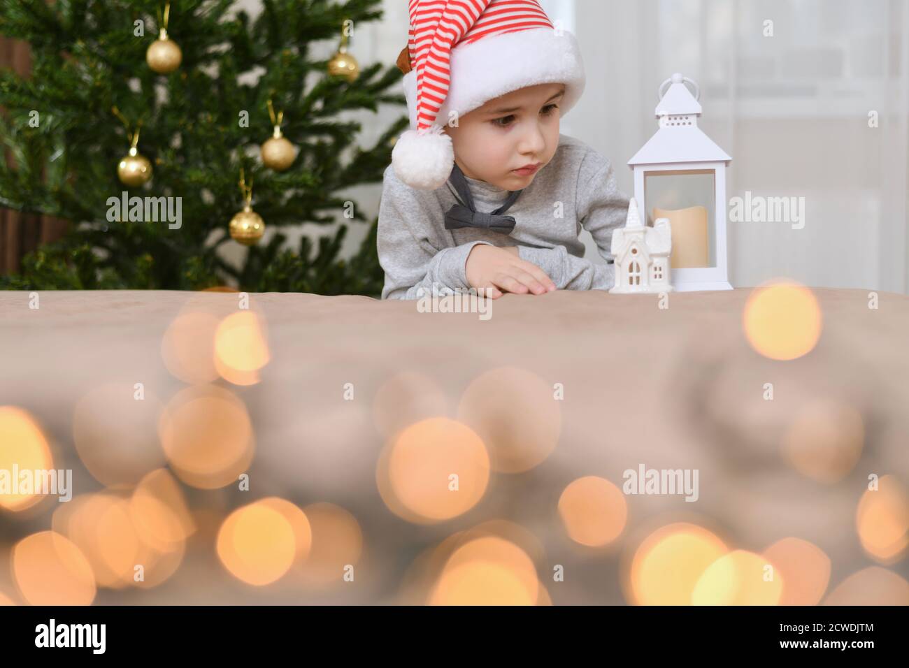 Sad kid, with chubby cheeks and inflated sponges, looks sad eyes at the ...