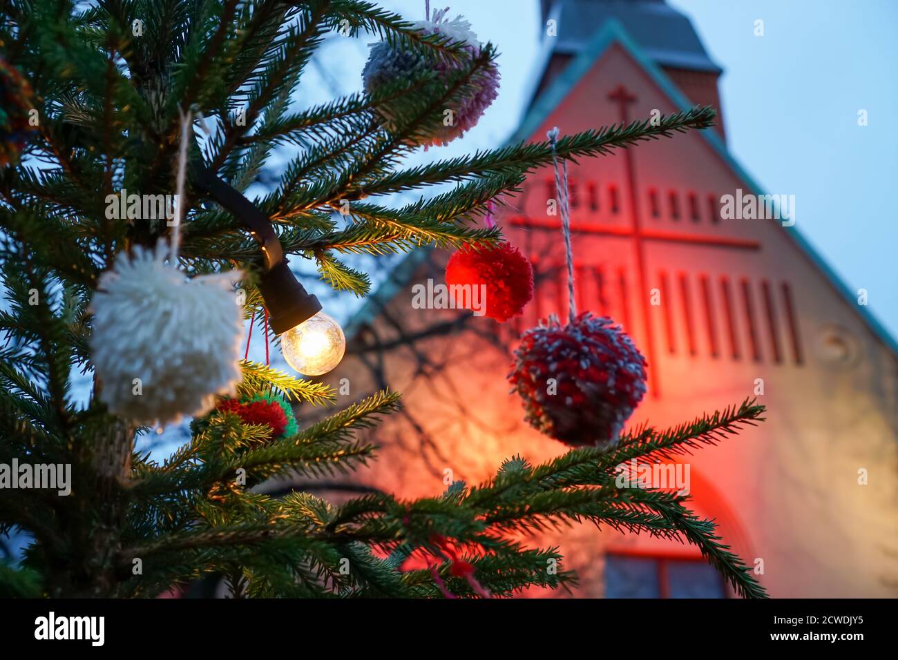 Puff balls in a Christmas tree in front of a church Stock Photo - Alamy
