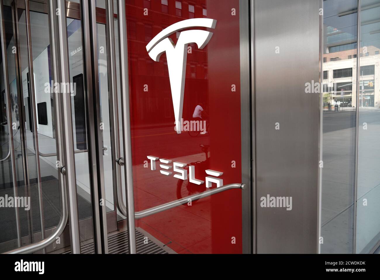 Tesla logo at their showroom.Tesla’s next factory is going to be in ...